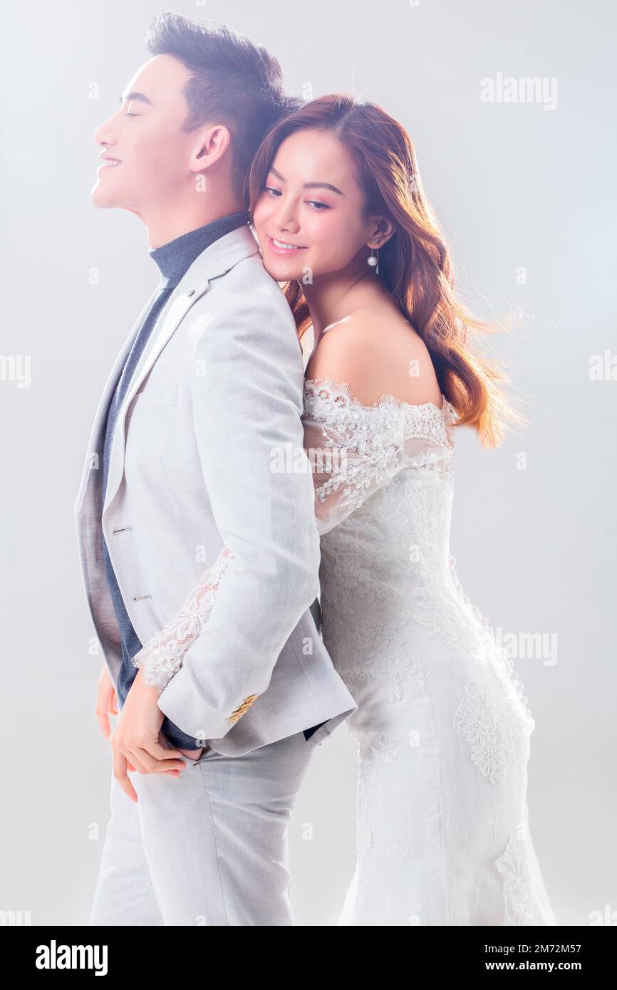 Happy and sweet bride and groom Stock Photo - Alamy