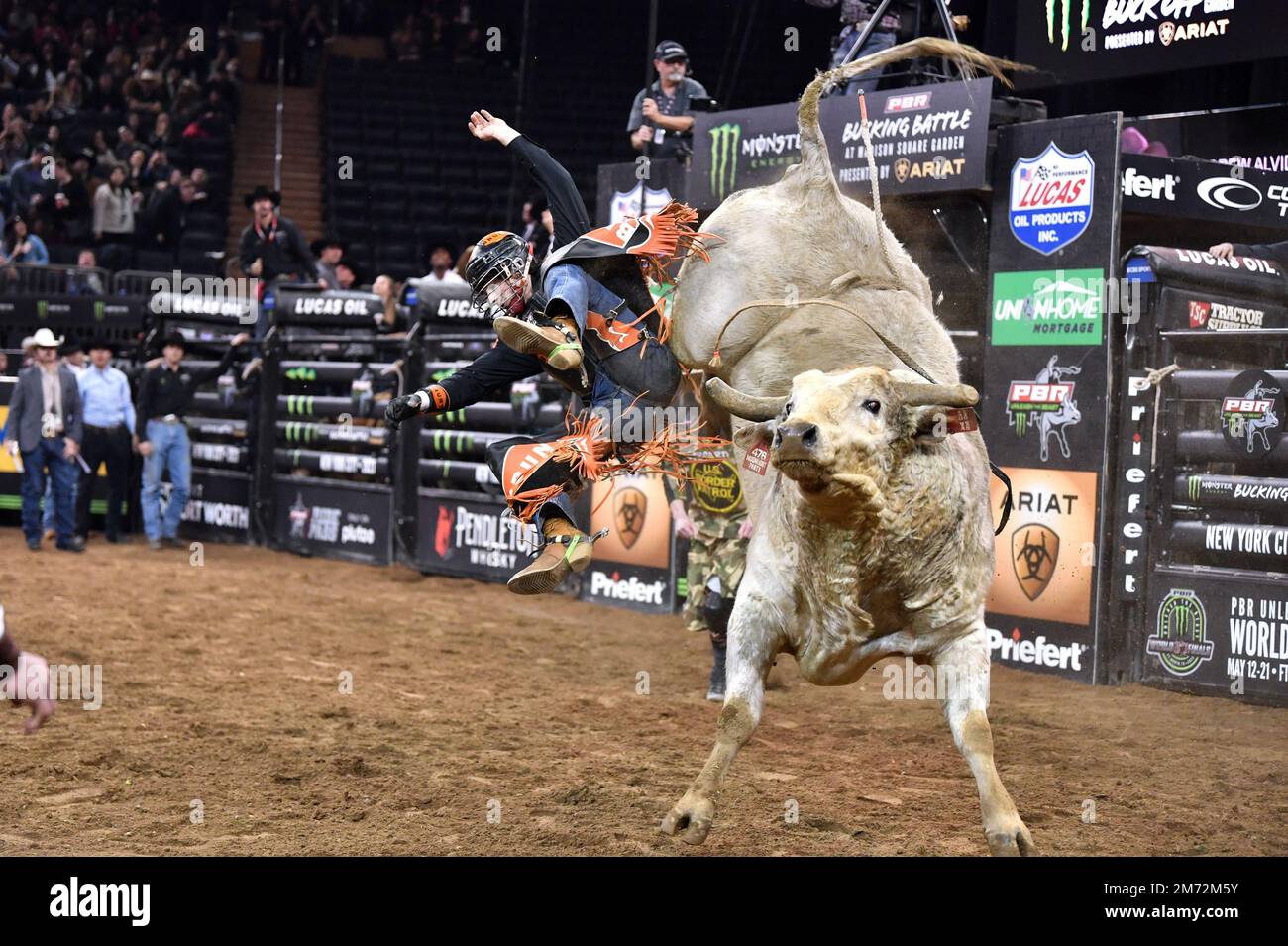 Professional Bull Rider Casey Roberts (USA) is thrown off a bull named Moonlight Party during ...