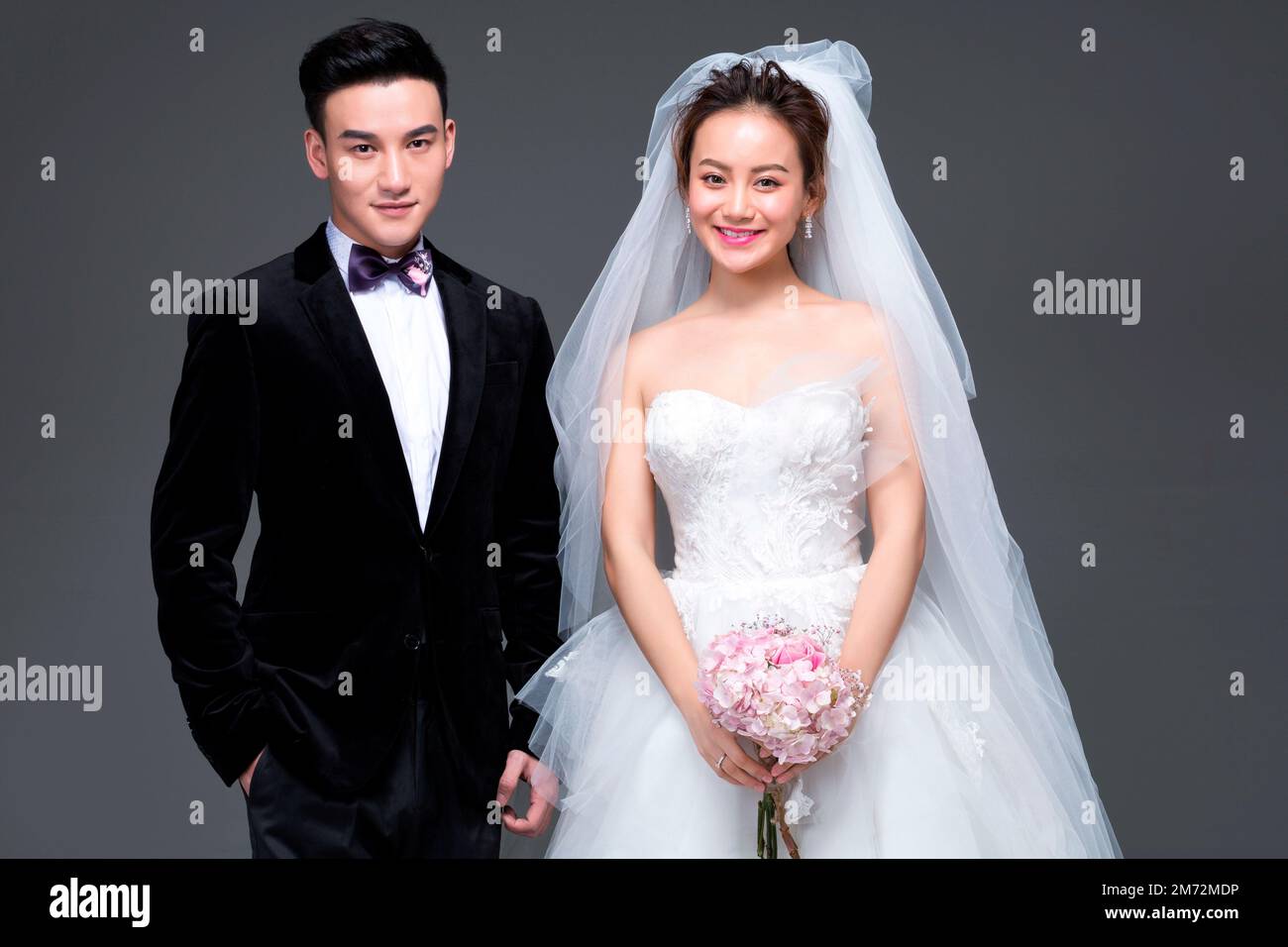 Happy and sweet bride and groom Stock Photo - Alamy