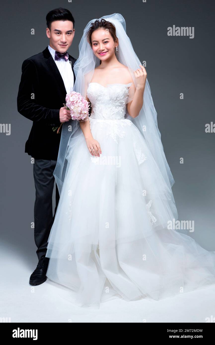Happy and sweet bride and groom Stock Photo - Alamy