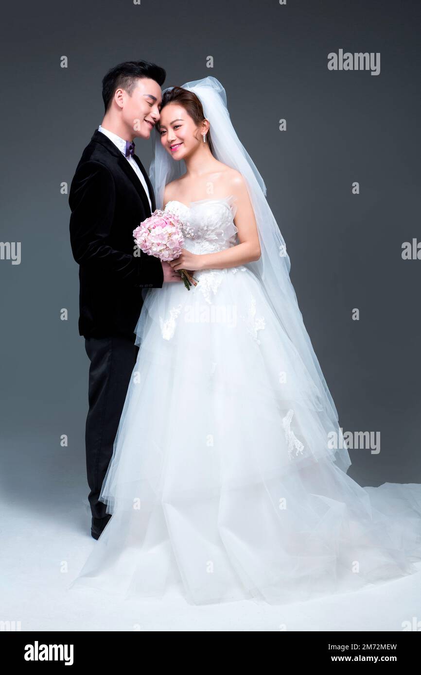 Happy and sweet bride and groom Stock Photo - Alamy