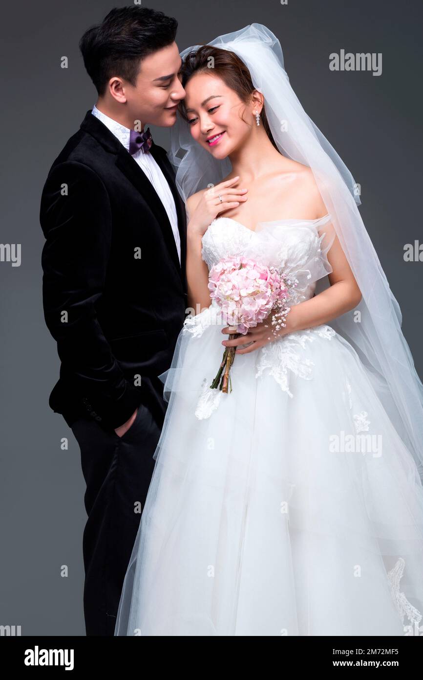 Happy and sweet bride and groom Stock Photo - Alamy