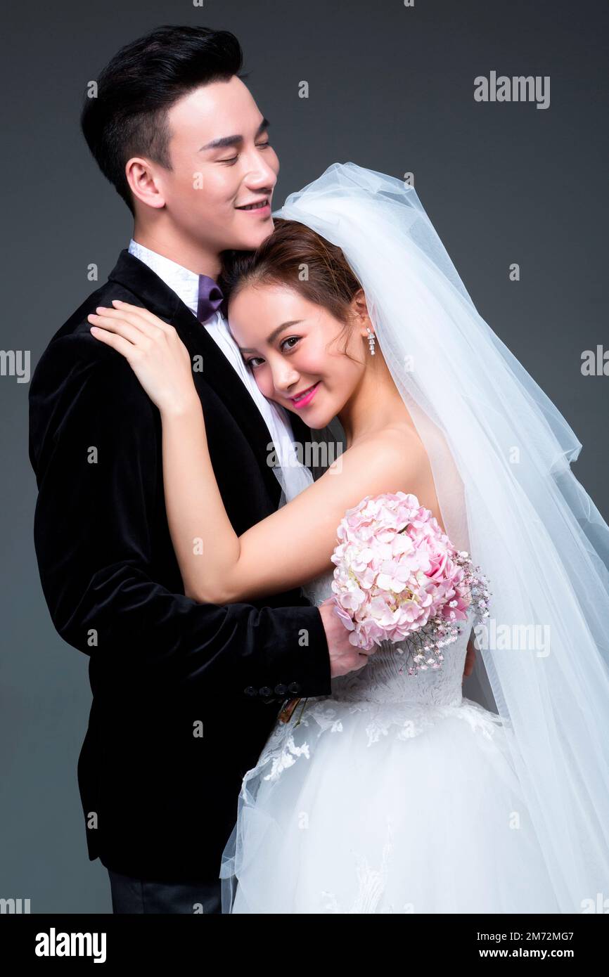 Happy and sweet bride and groom Stock Photo - Alamy