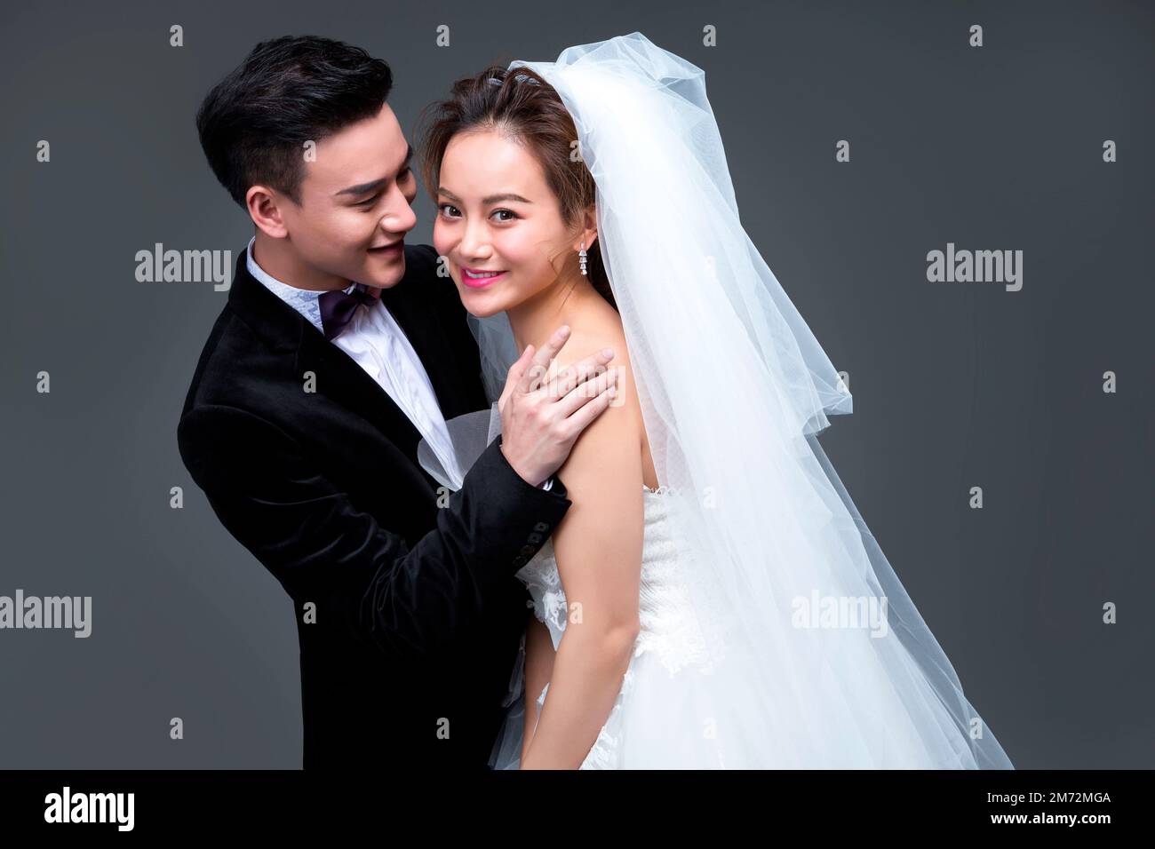 Happy and sweet bride and groom Stock Photo - Alamy