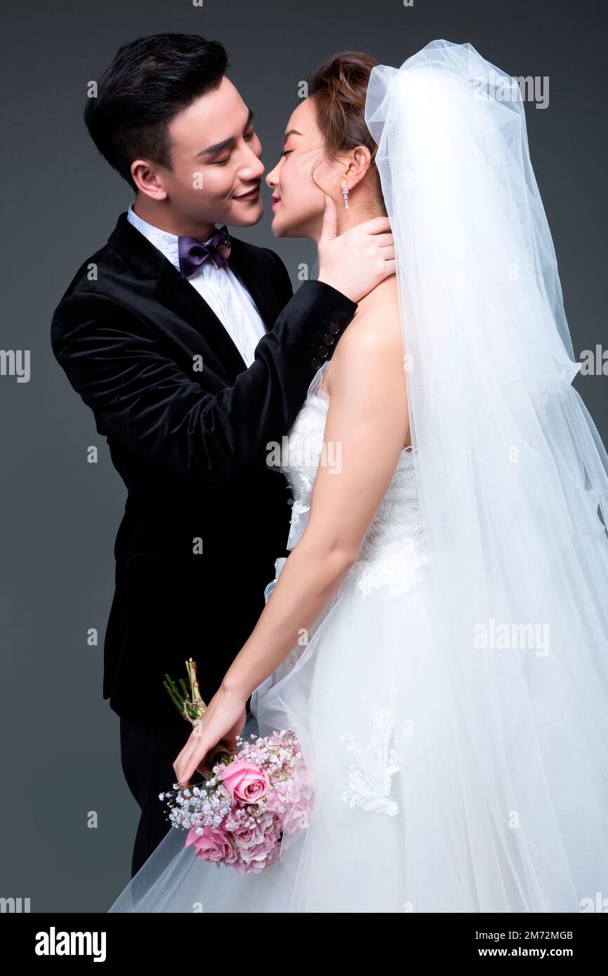 Happy and sweet bride and groom Stock Photo - Alamy