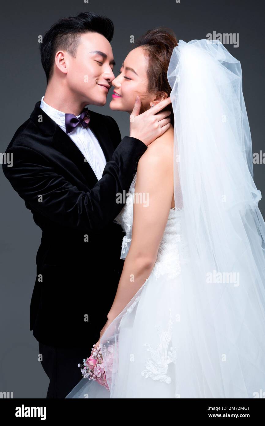 Happy and sweet bride and groom Stock Photo - Alamy