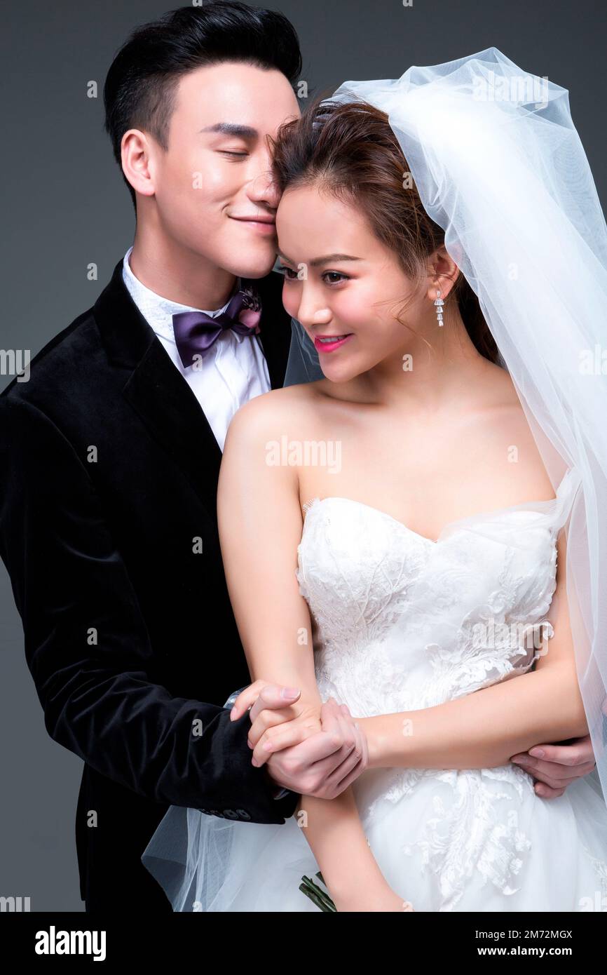 Happy and sweet bride and groom Stock Photo - Alamy