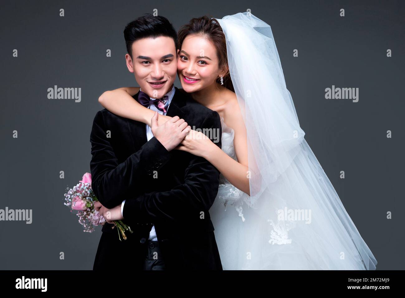 Happy and sweet bride and groom Stock Photo - Alamy