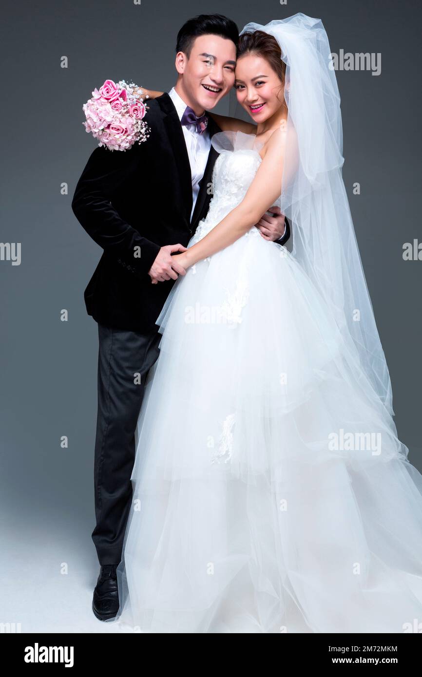 Happy and sweet bride and groom Stock Photo - Alamy