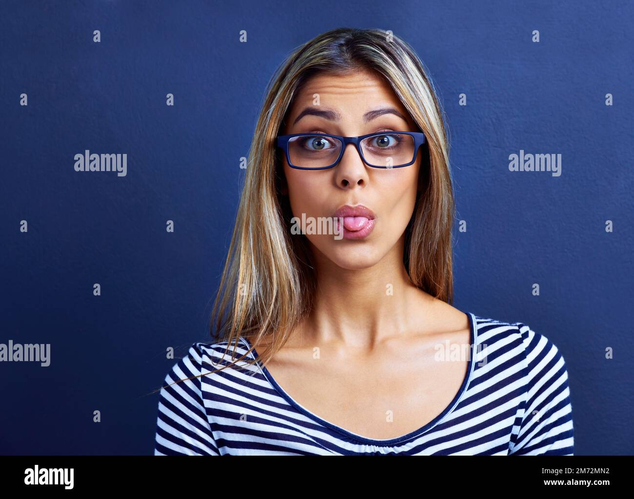 Being Silly Portrait Of A Beautiful Young Woman Sticking Out Her