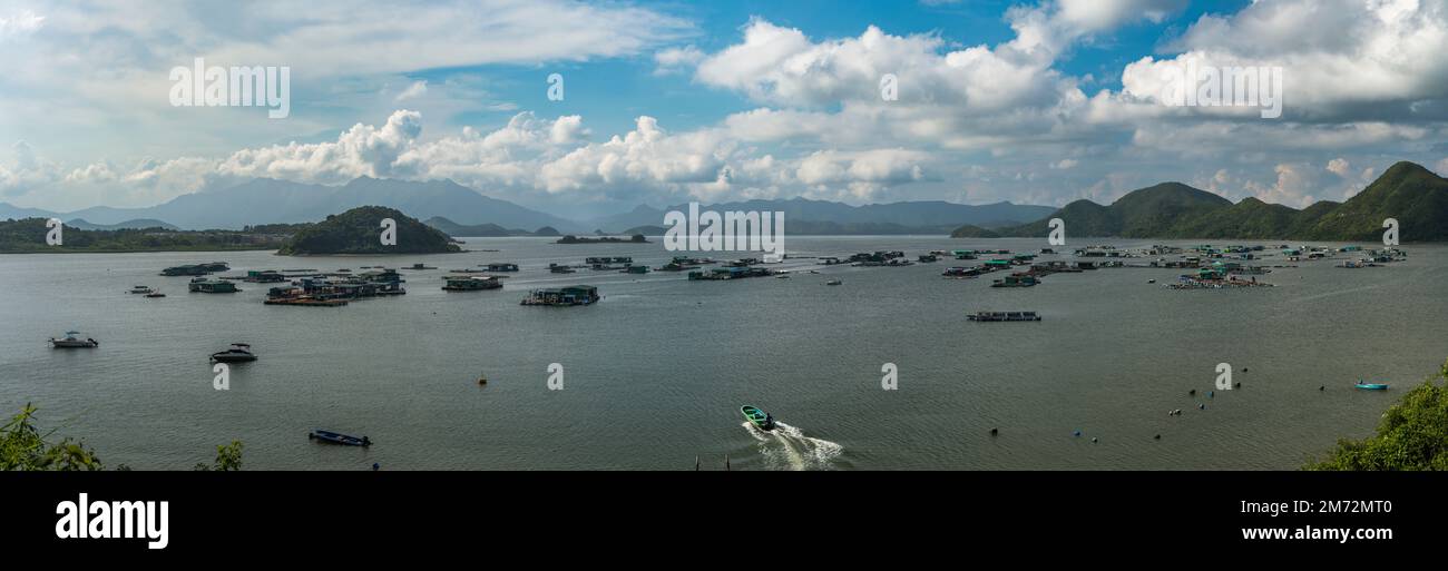 Hi-resolution panorama of fish farms in Three Fathoms Cove with surrounding hills and mountains ...