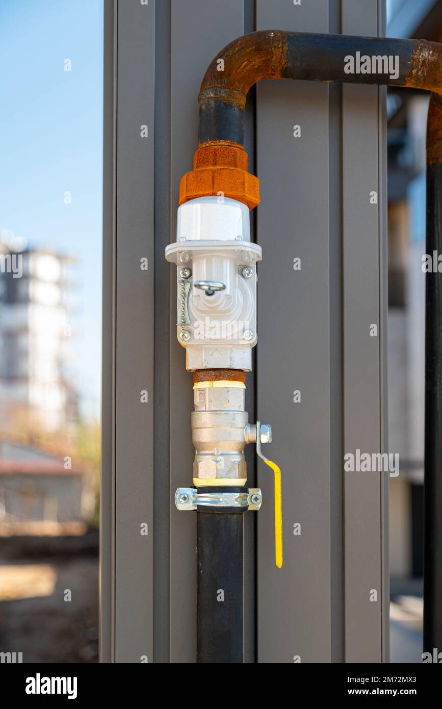 Natural gas pipe and valve mounted on the building column Stock Photo ...
