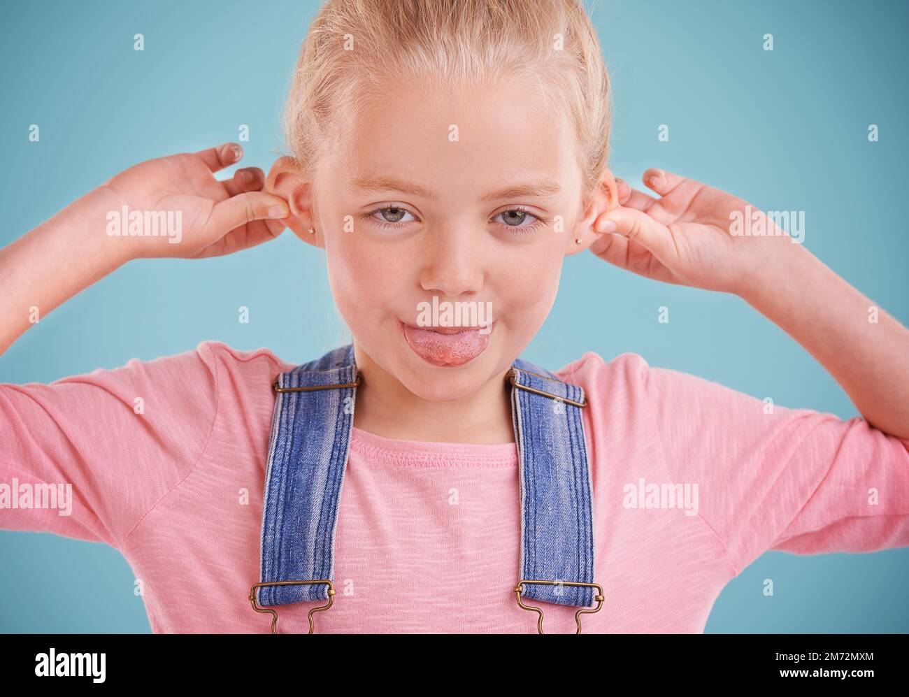 Nah Nah Na Nah. A cute little girl pulling a funny face against an ...