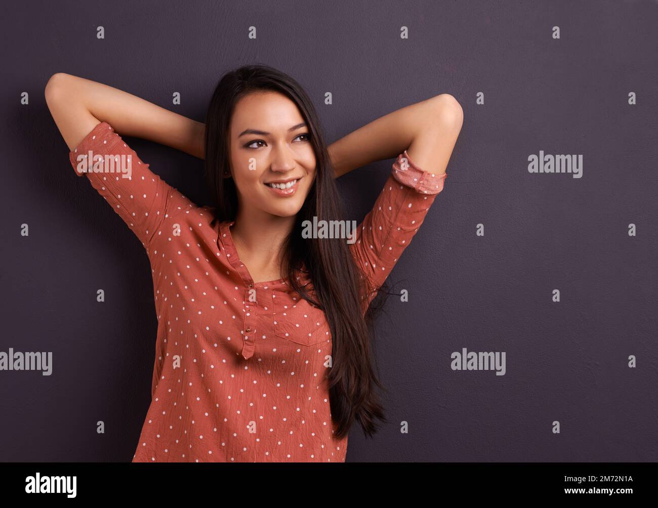 Shes beautiful in her casual nature. Studio shot of an attractive young ...