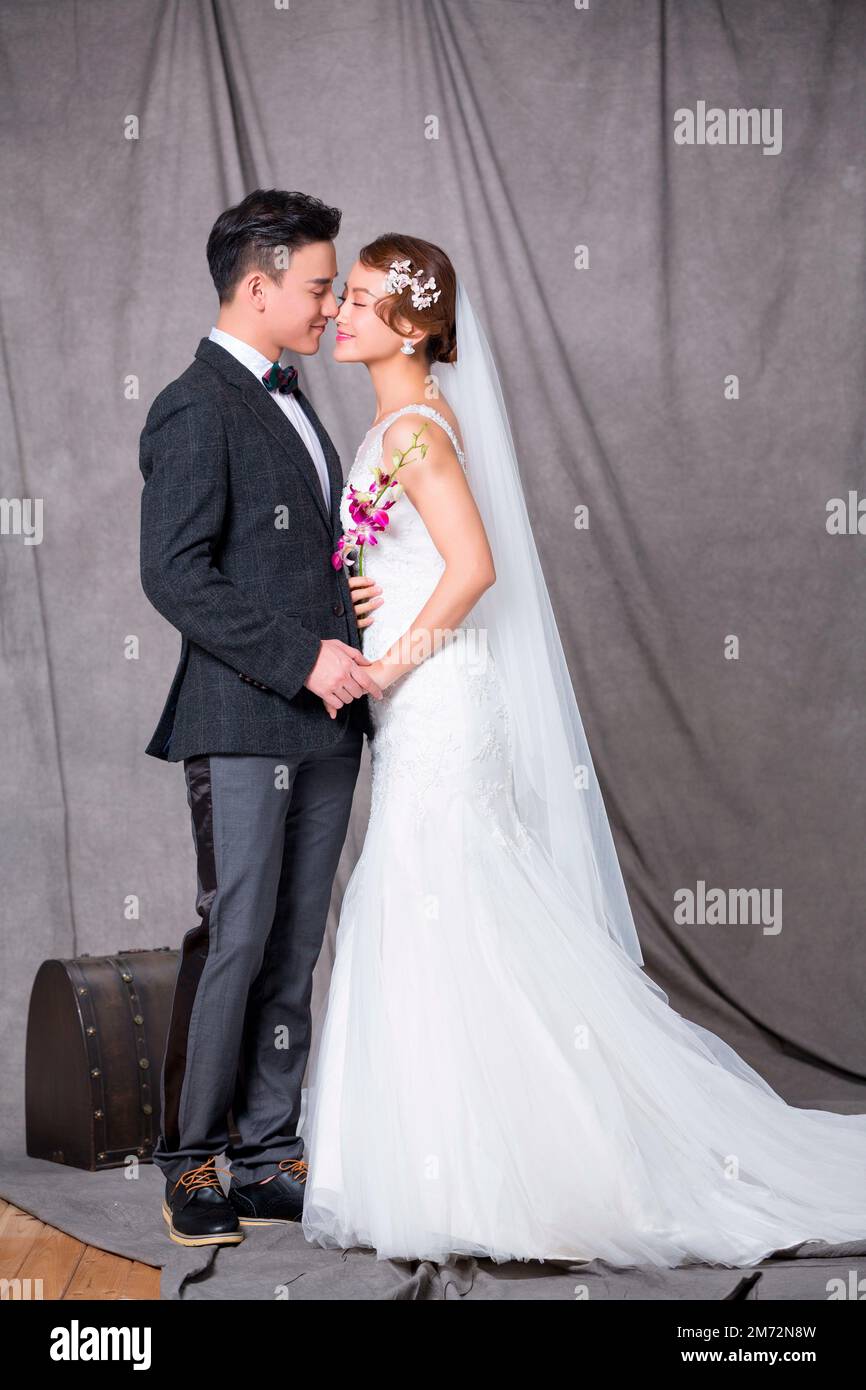 Happy and sweet bride and groom Stock Photo - Alamy