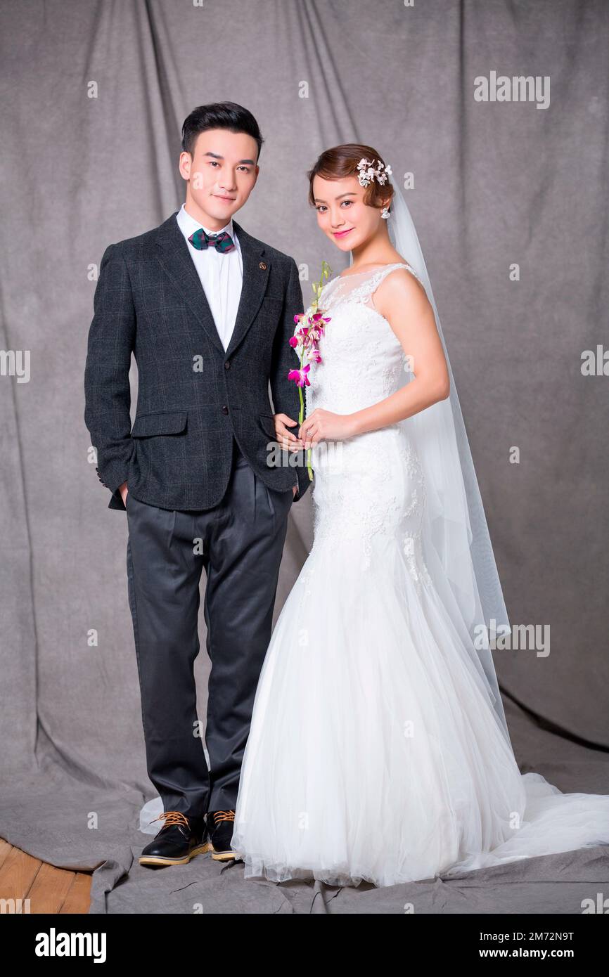 Happy and sweet bride and groom Stock Photo - Alamy