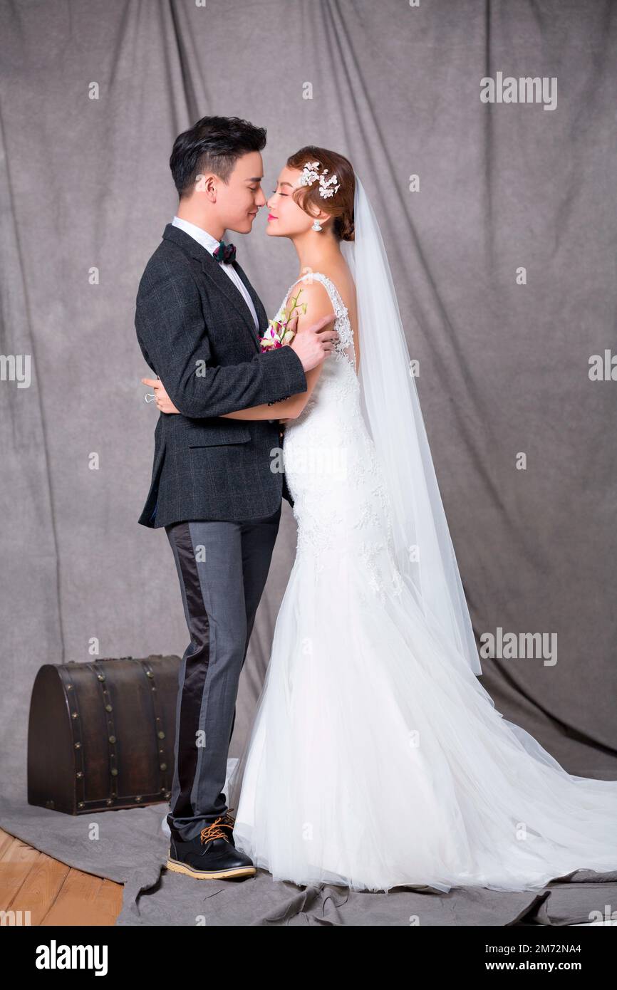 Happy and sweet bride and groom Stock Photo - Alamy