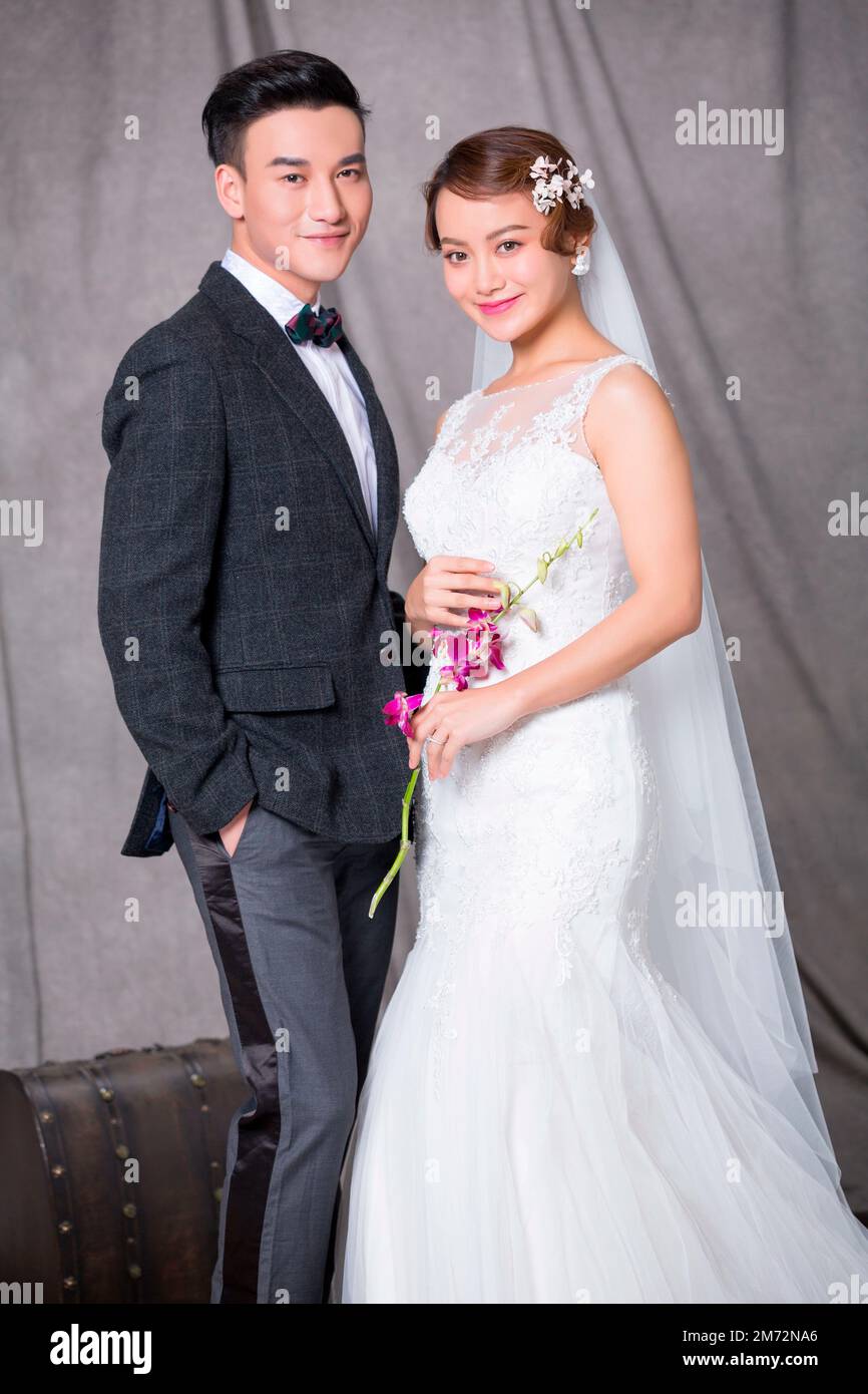 Happy and sweet bride and groom Stock Photo - Alamy