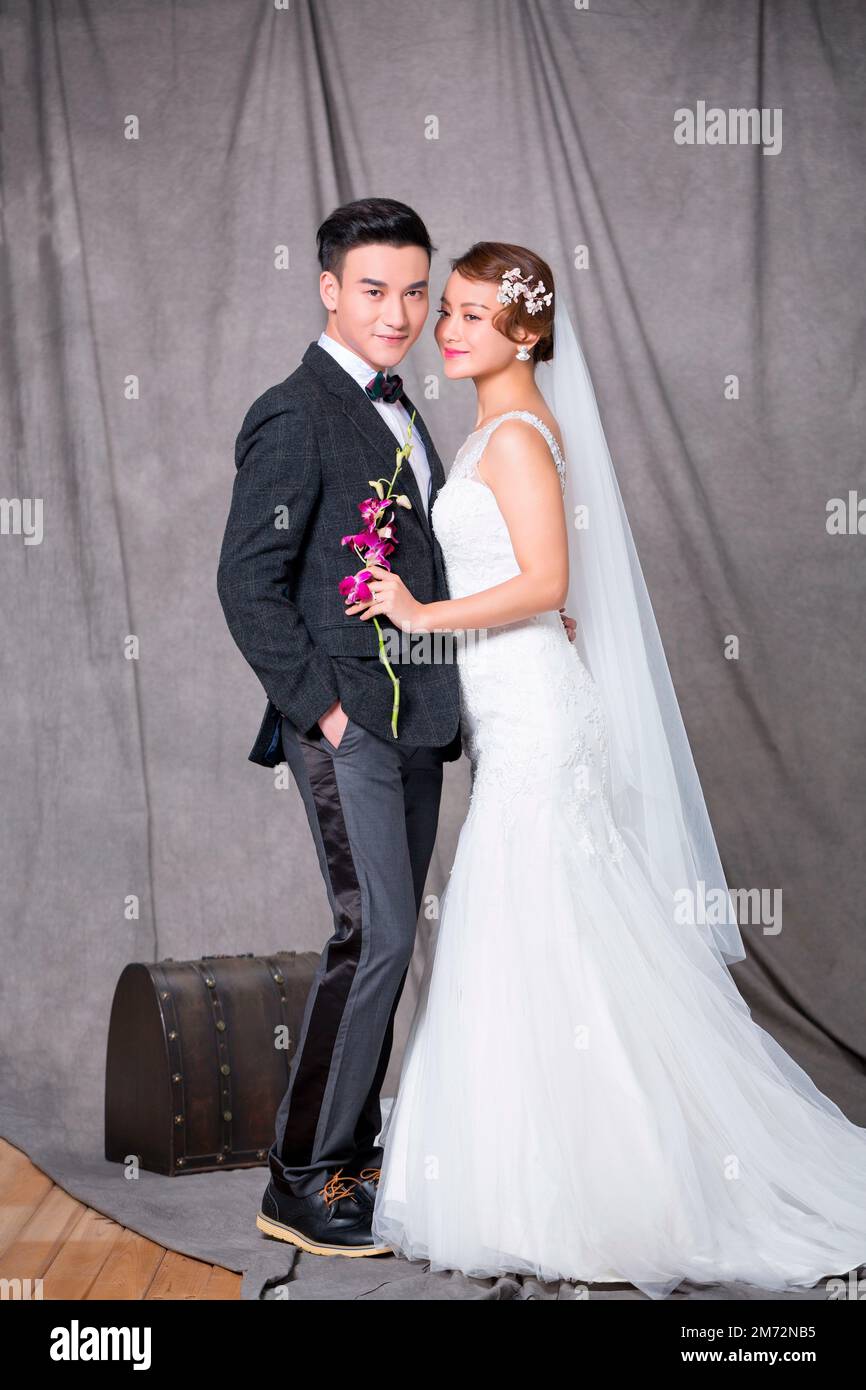 Happy and sweet bride and groom Stock Photo - Alamy