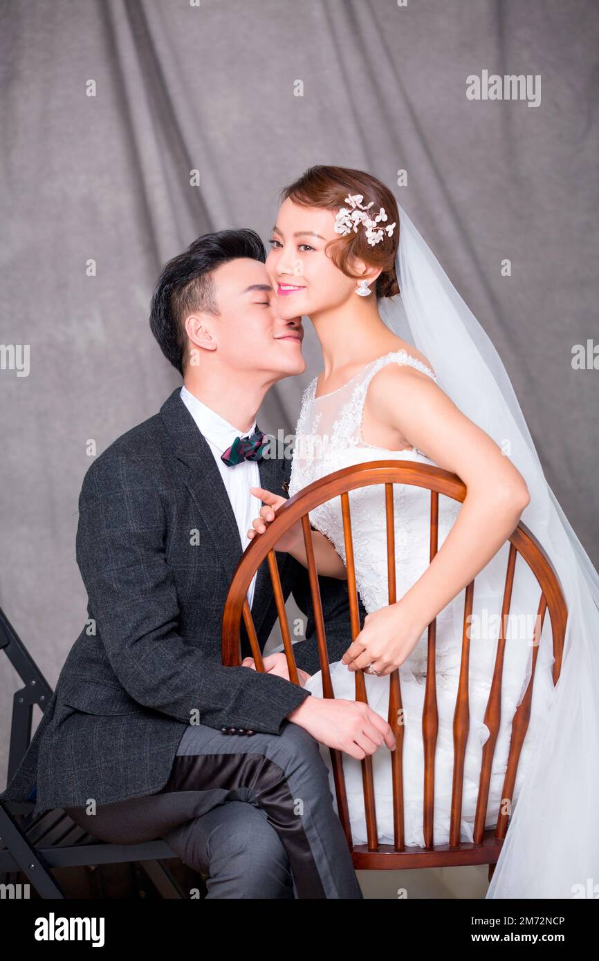 Happy and sweet bride and groom Stock Photo - Alamy