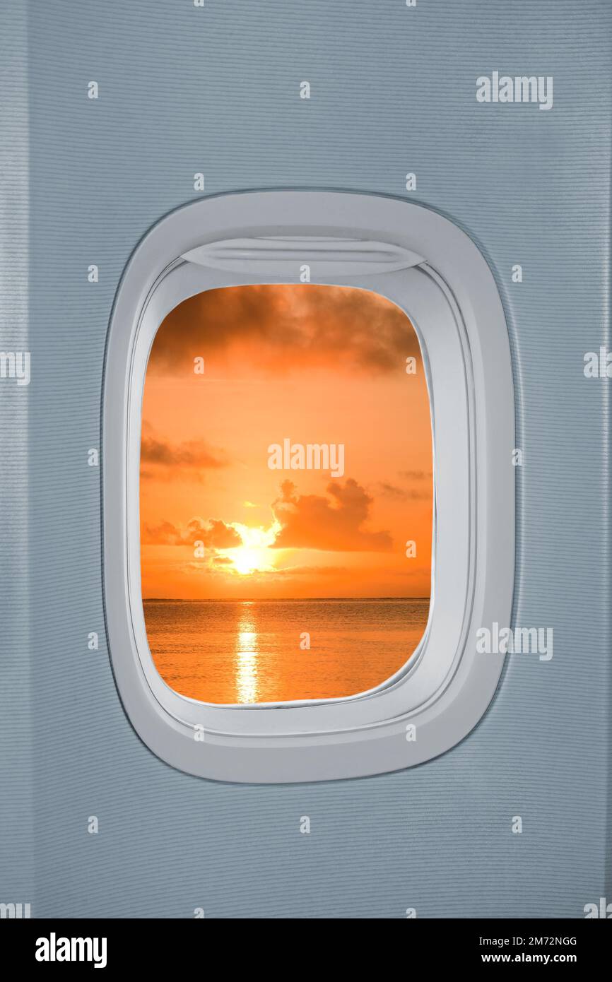 Airplane window with sunrise scene Stock Photo - Alamy