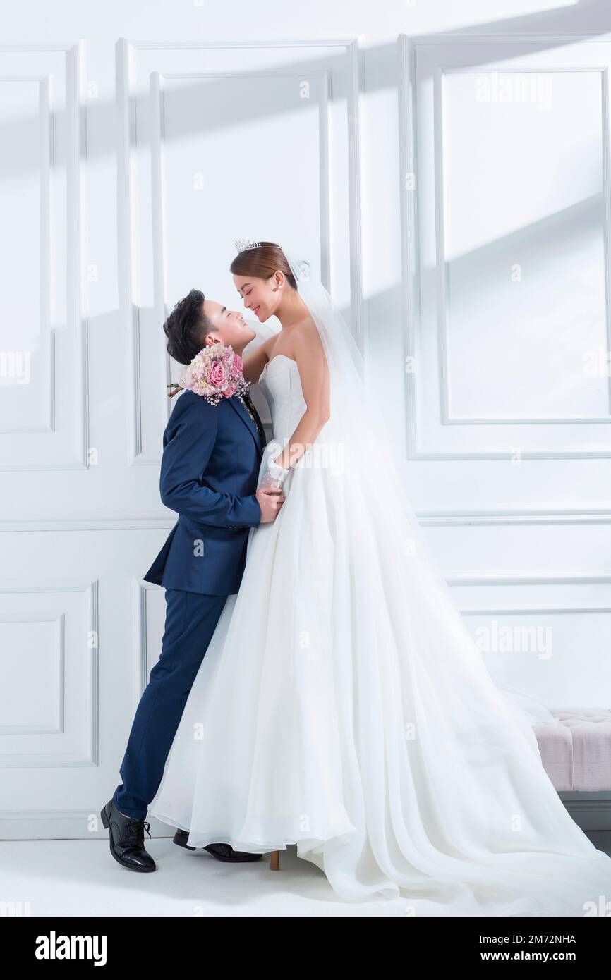 Happy and sweet bride and groom Stock Photo - Alamy