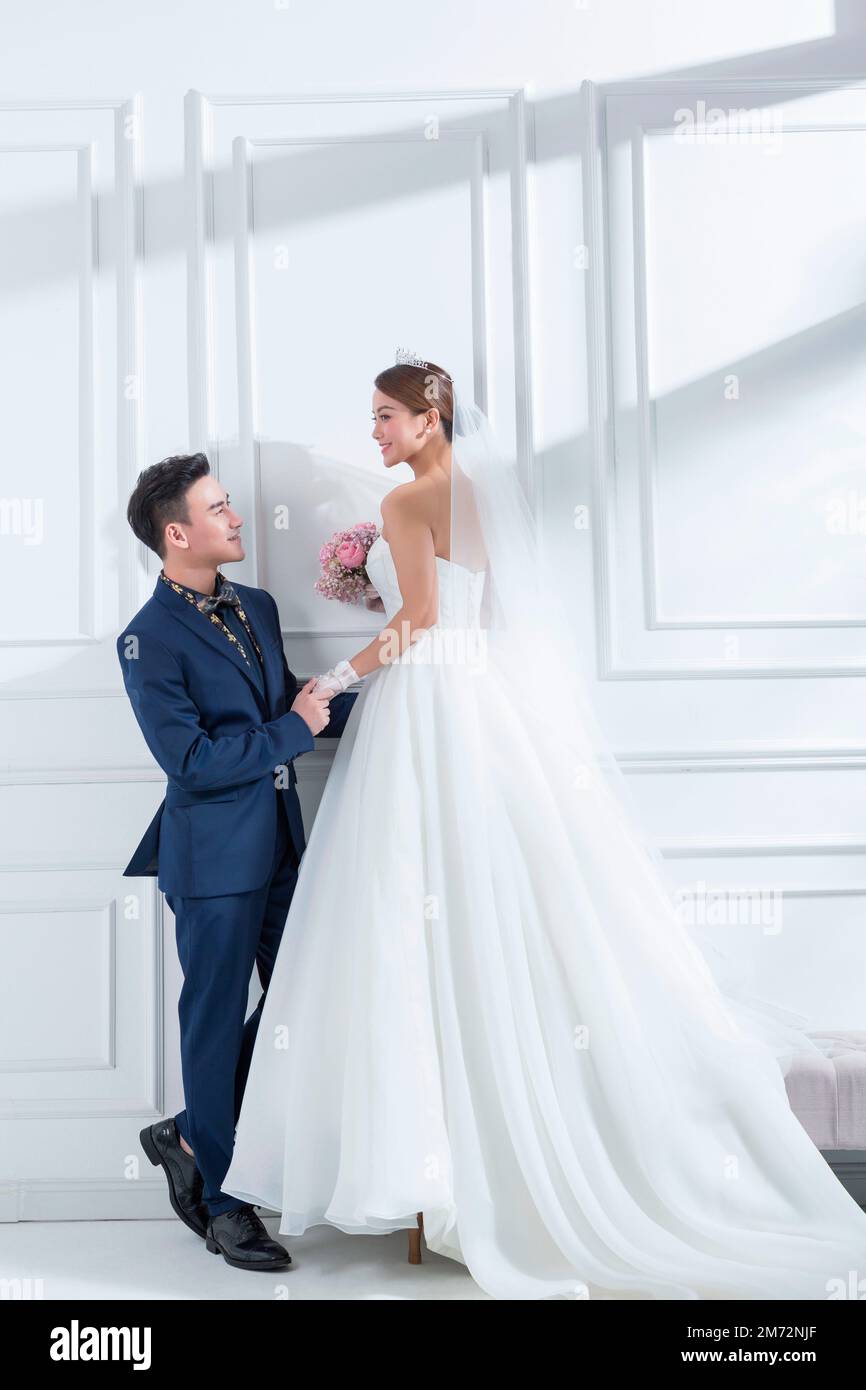 Happy and sweet bride and groom Stock Photo - Alamy