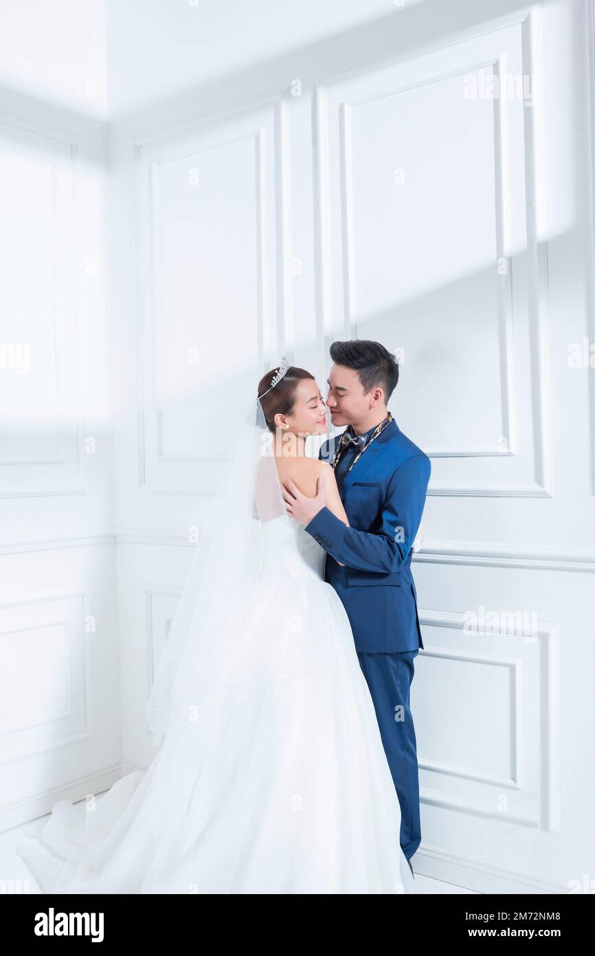 Happy and sweet bride and groom Stock Photo - Alamy