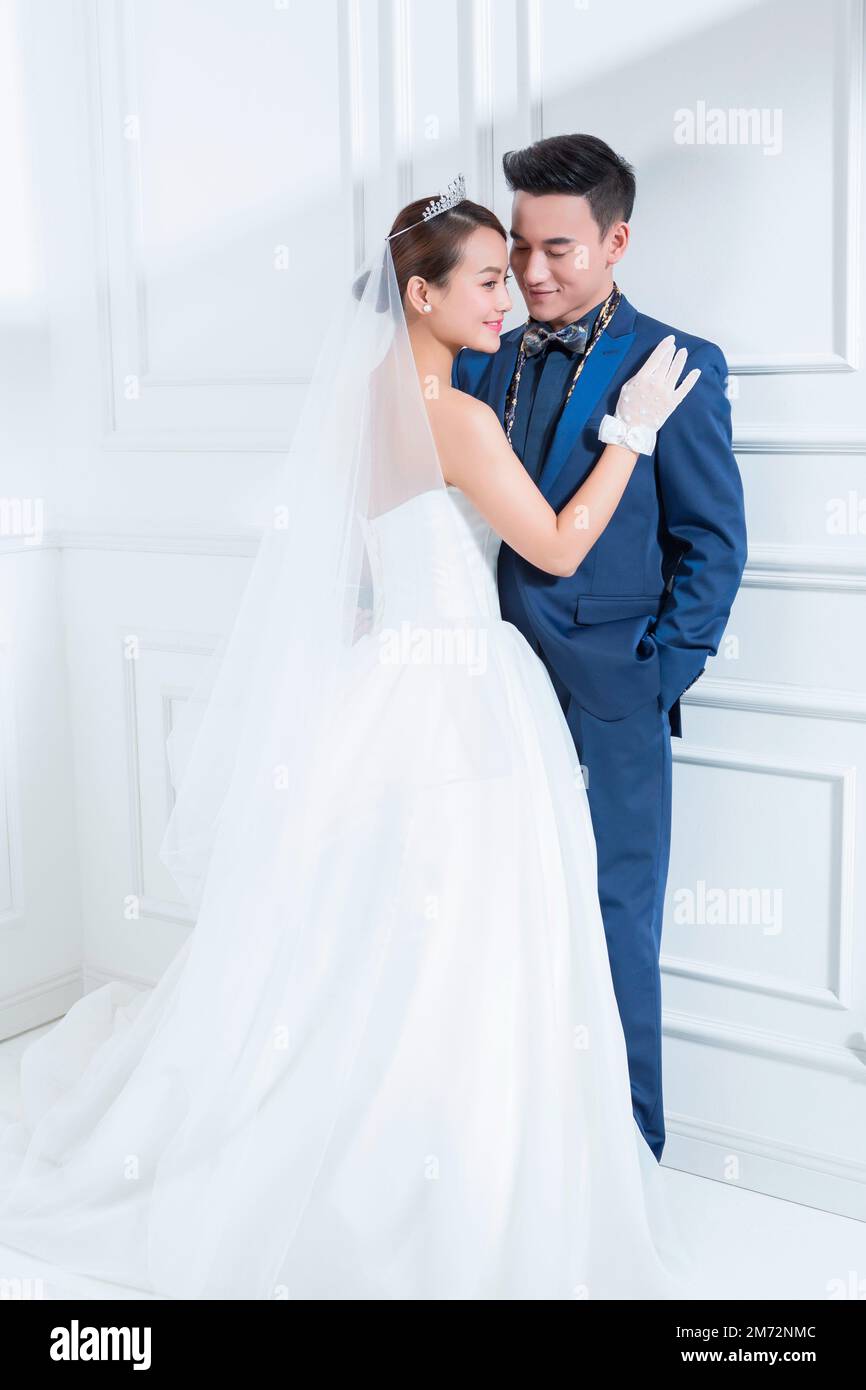 Happy and sweet bride and groom Stock Photo - Alamy