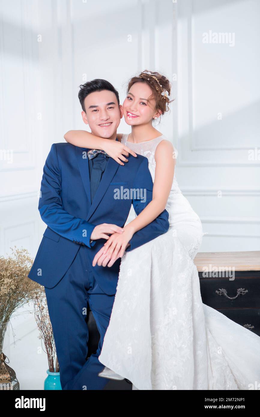 Happy and sweet bride and groom Stock Photo - Alamy