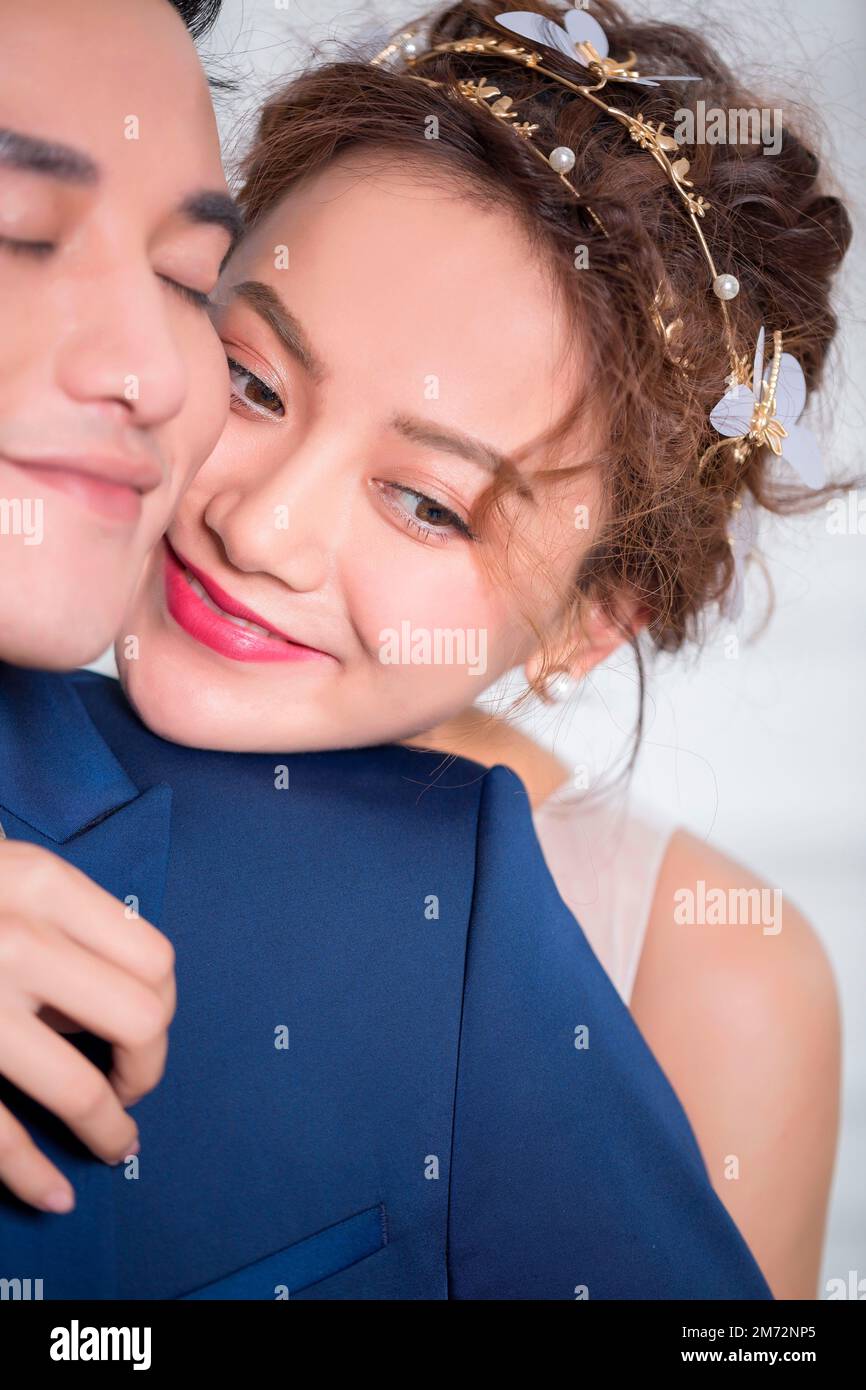 Happy and sweet bride and groom Stock Photo - Alamy
