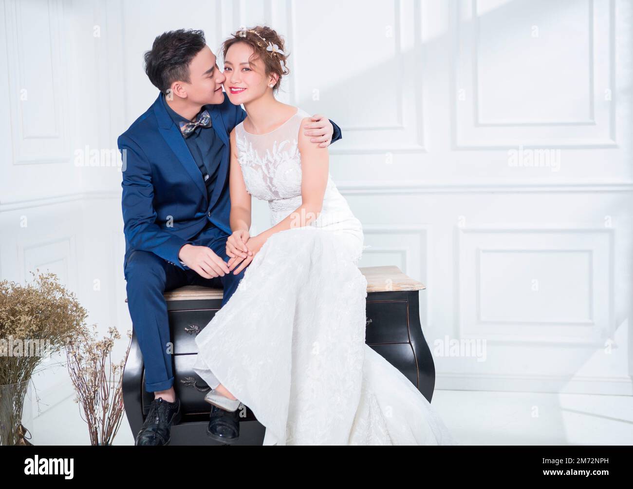 Happy and sweet bride and groom Stock Photo - Alamy