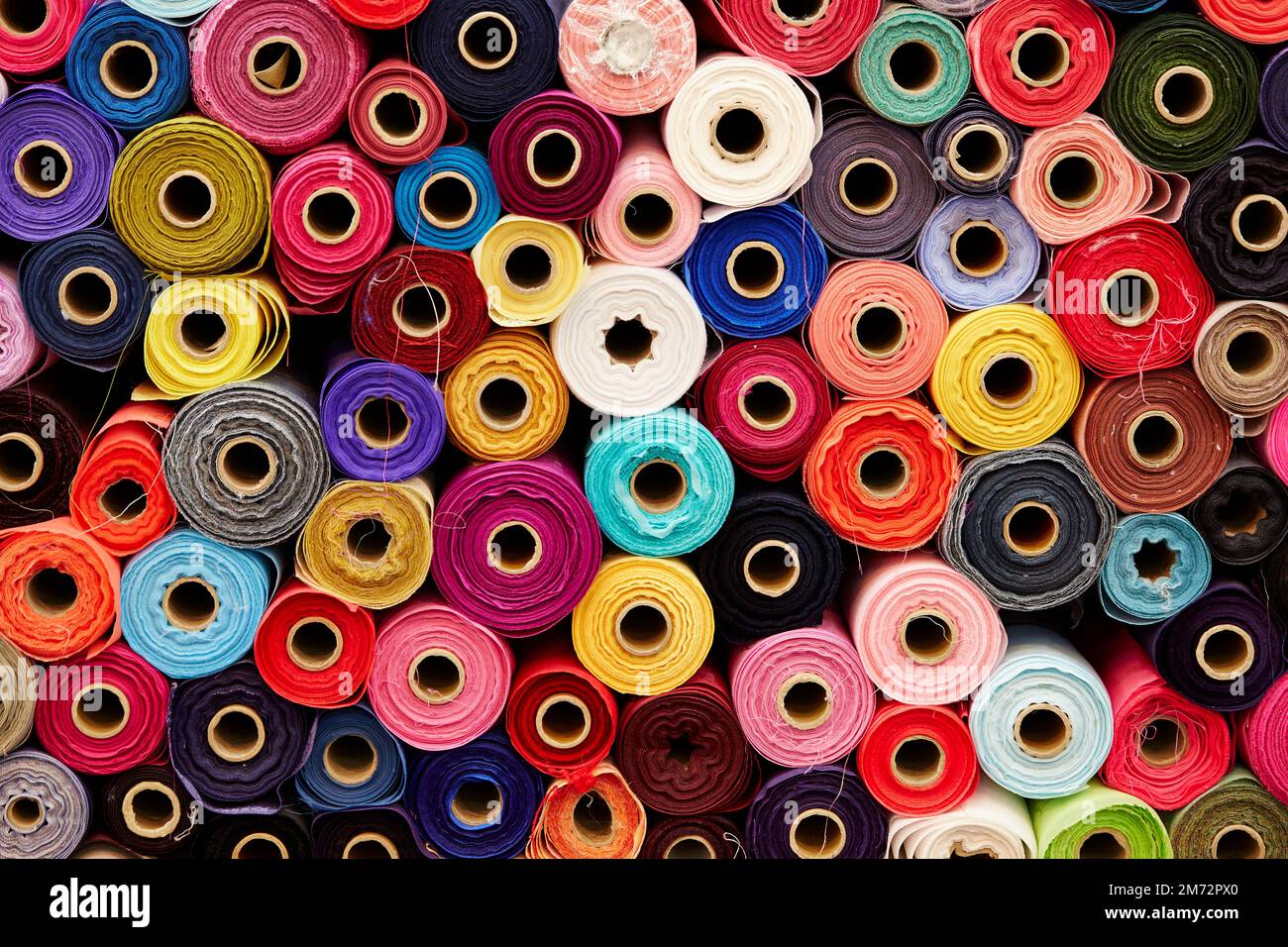 Roll fabrics displayed in a traditional market Stock Photo - Alamy