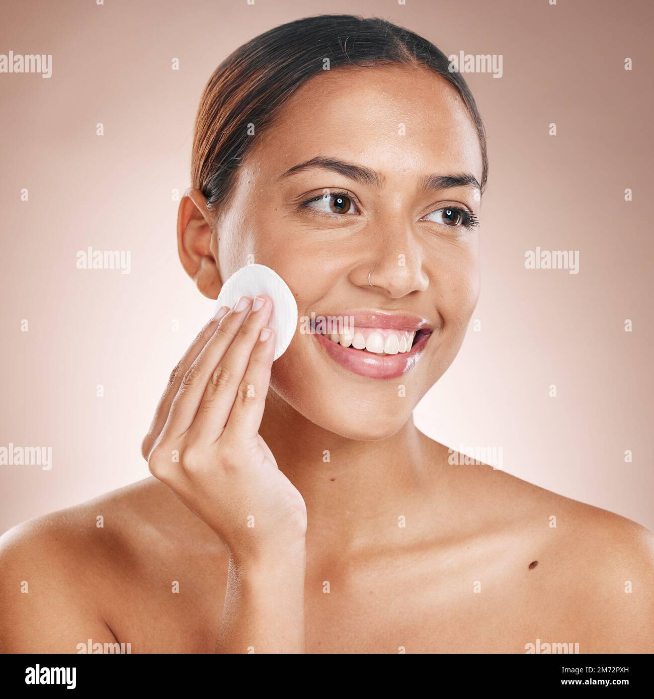 Cotton pad, skincare and woman with face beauty, facial treatment wellness and happy cleaning ...