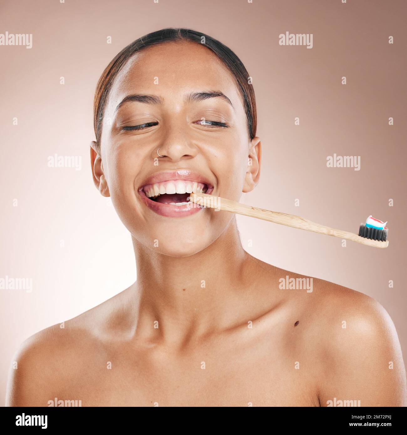 Fun woman, face or toothbrush on studio background in dental care ...