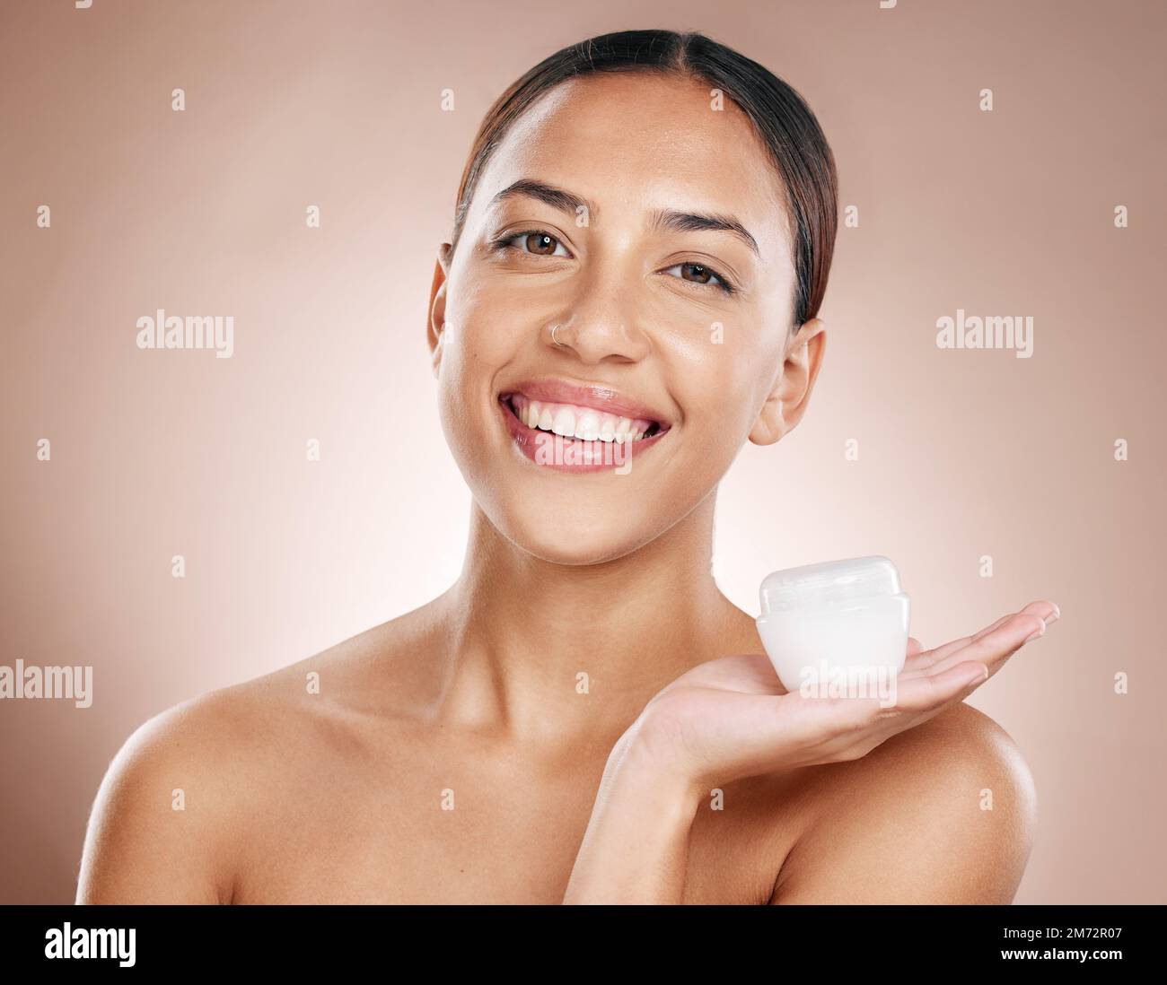 Woman portrait, face skincare or cream container on studio background ...