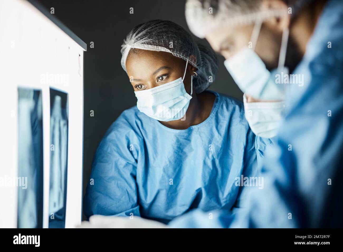 X ray, exam and covid doctors meeting for a healthcare diagnosis ...