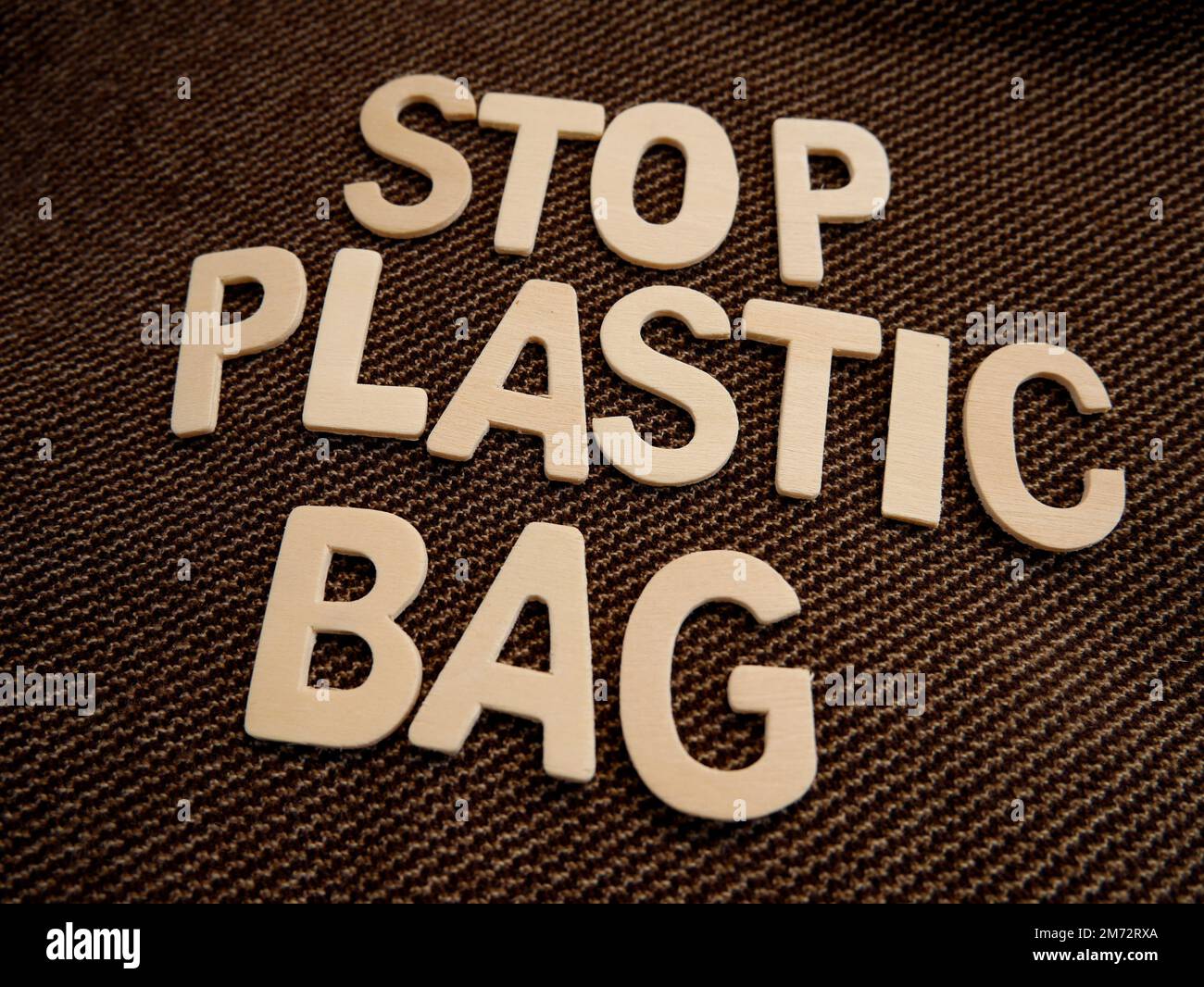 Text "Stop plastic bag" on cotton bag background, on top view Stock ...