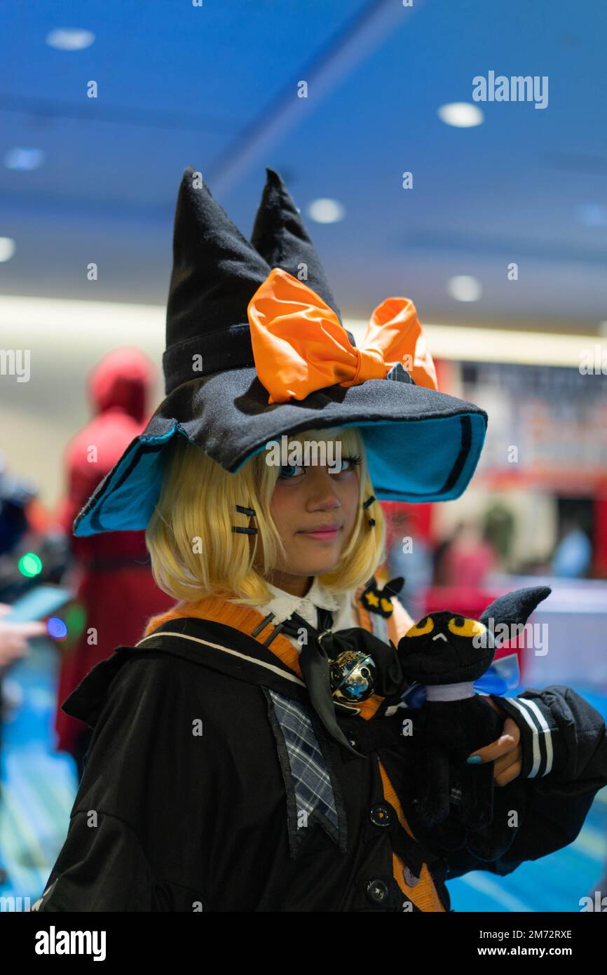 A vertical of a girl cosplaying as Vtuber streamer Millie Parfait at ...