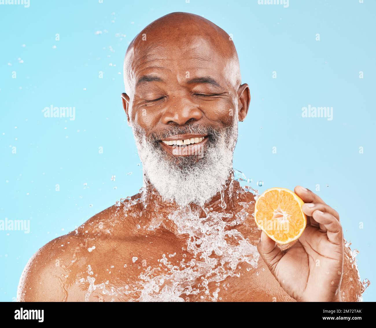 Lemon, water splash and senior man for skincare health, vegan product ...