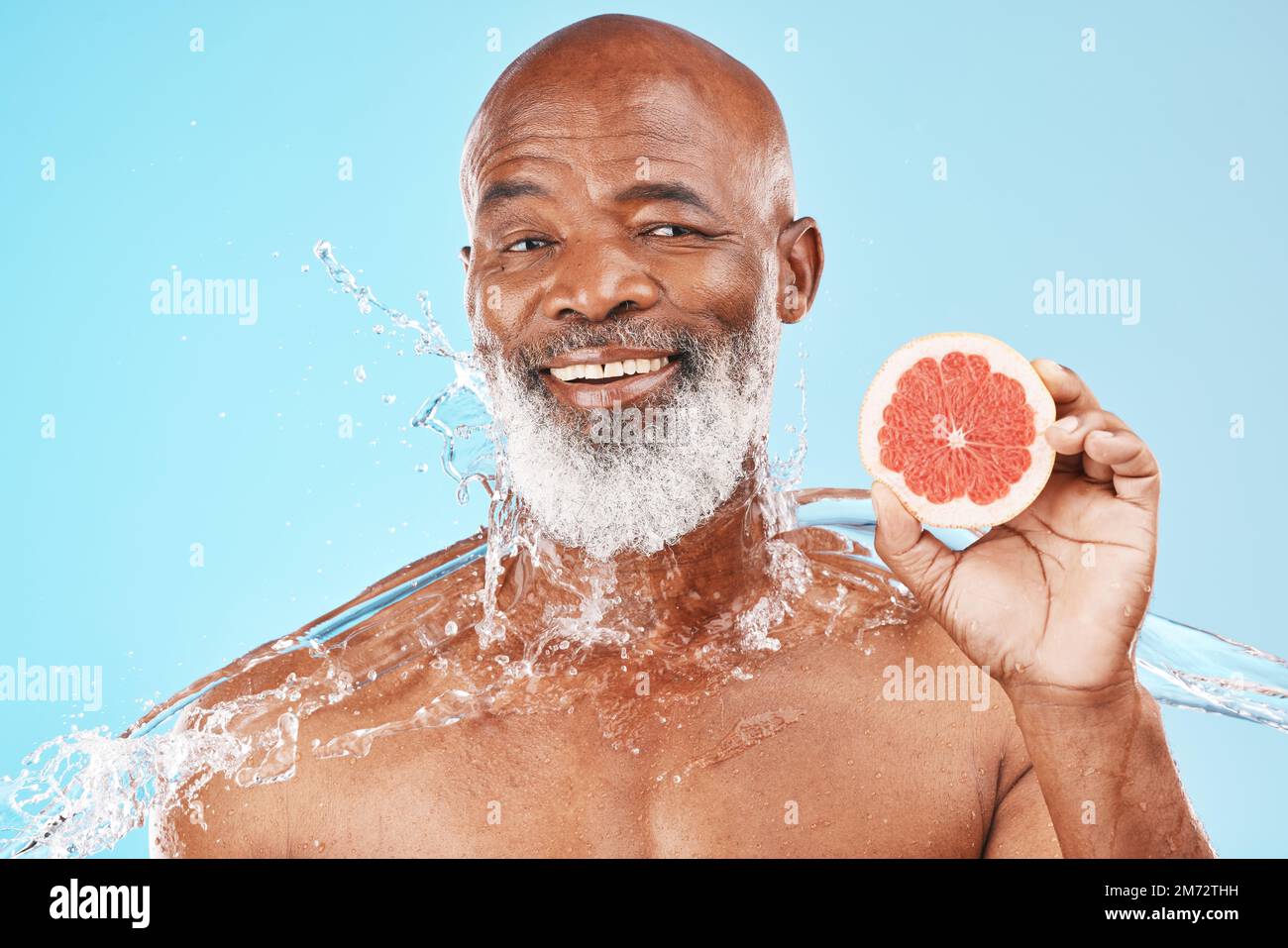 Grapefruit, water splash and black man for skincare health, vegan product or senior cosmetics ...