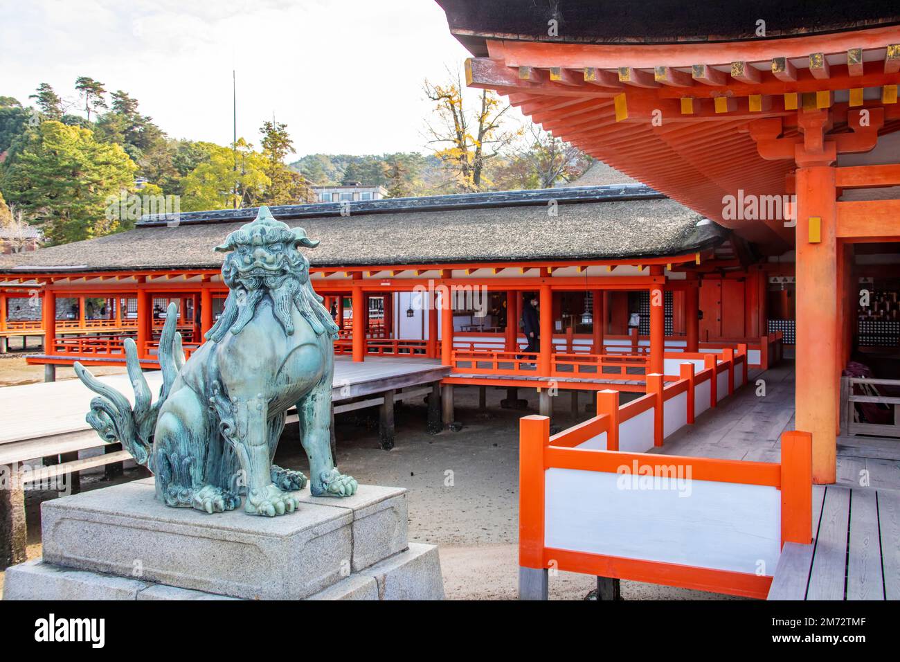 the bronze lion statue in Itsukushima Shrine. A Shinto shrine on the ...
