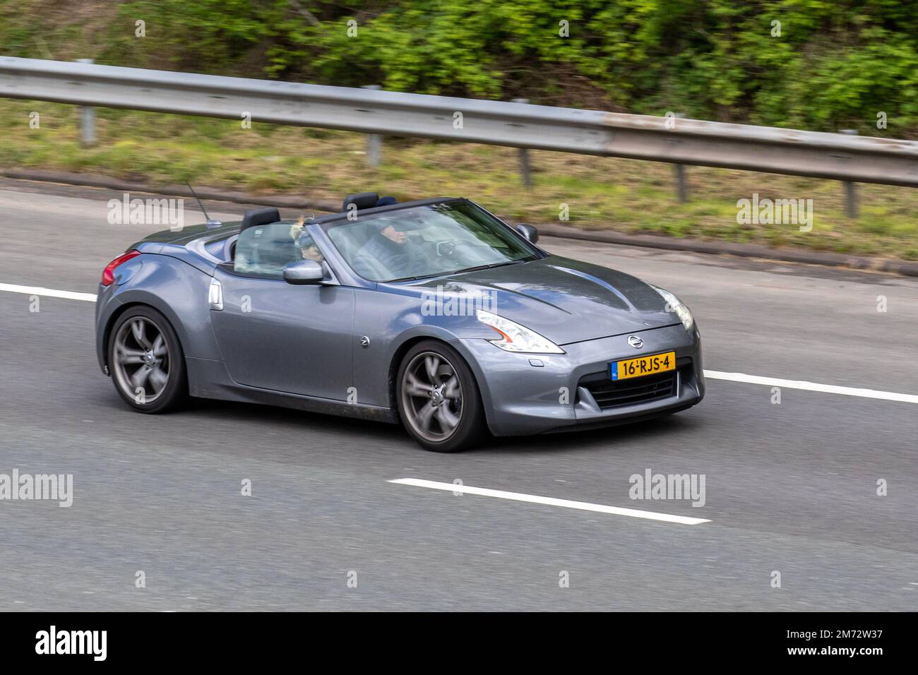 2010 Grey Silver NISSAN V6 GT 7-speed manual Cabrio; travelling on the ...