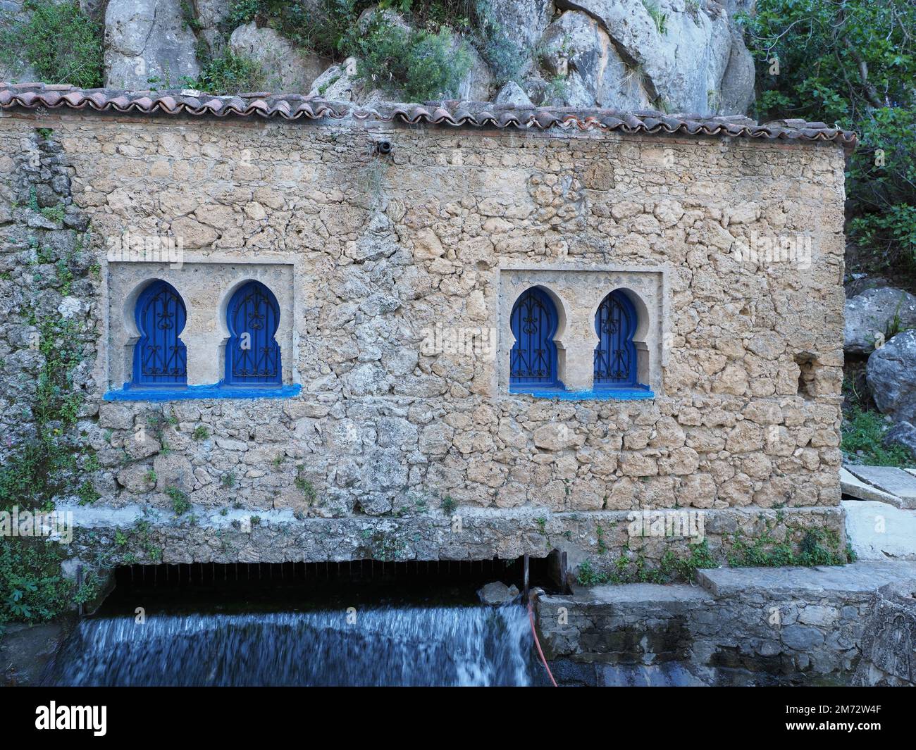 Historical building over Ras El Maa waterfall in african Chefchaouen ...