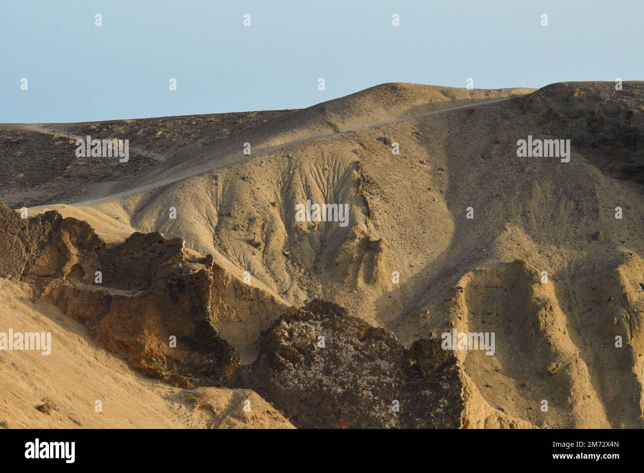 Sand dune between volcanic rocks at Playa Papagayo Stock Photo - Alamy