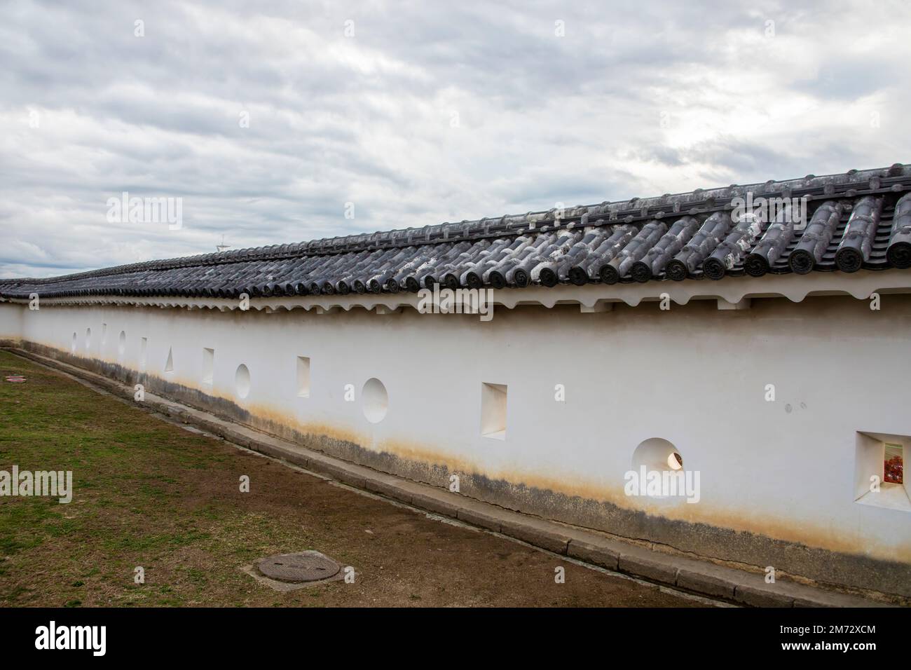 the wall in Himeji Castle, a hilltop Japanese castle complex. It is ...