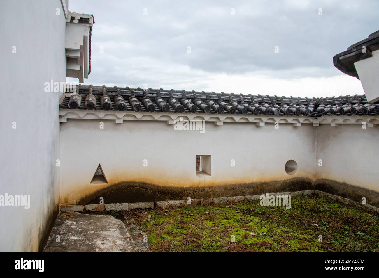 the wall in Himeji Castle, a hilltop Japanese castle complex. It is ...