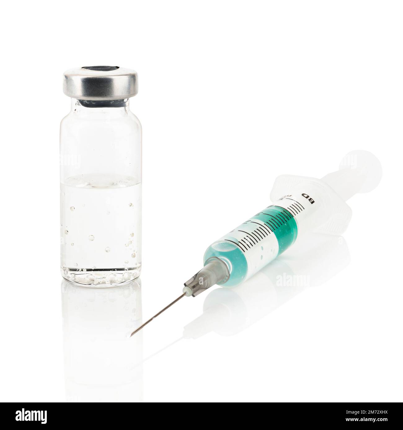 Syringe and a bottle with a solution for injections isolated on white ...