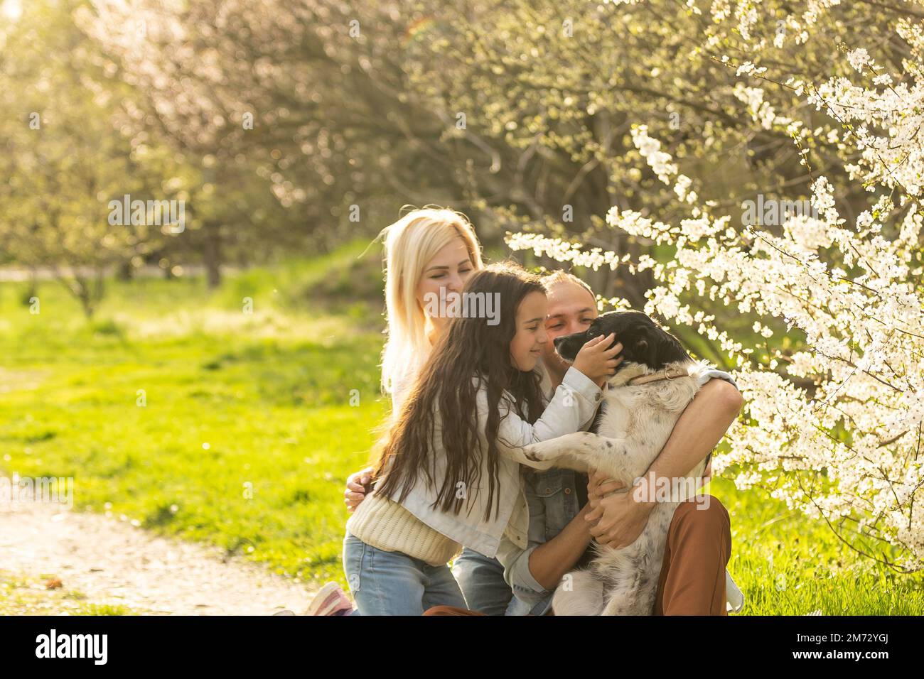 Family and child outdoors in spring nature, resting Stock Photo - Alamy