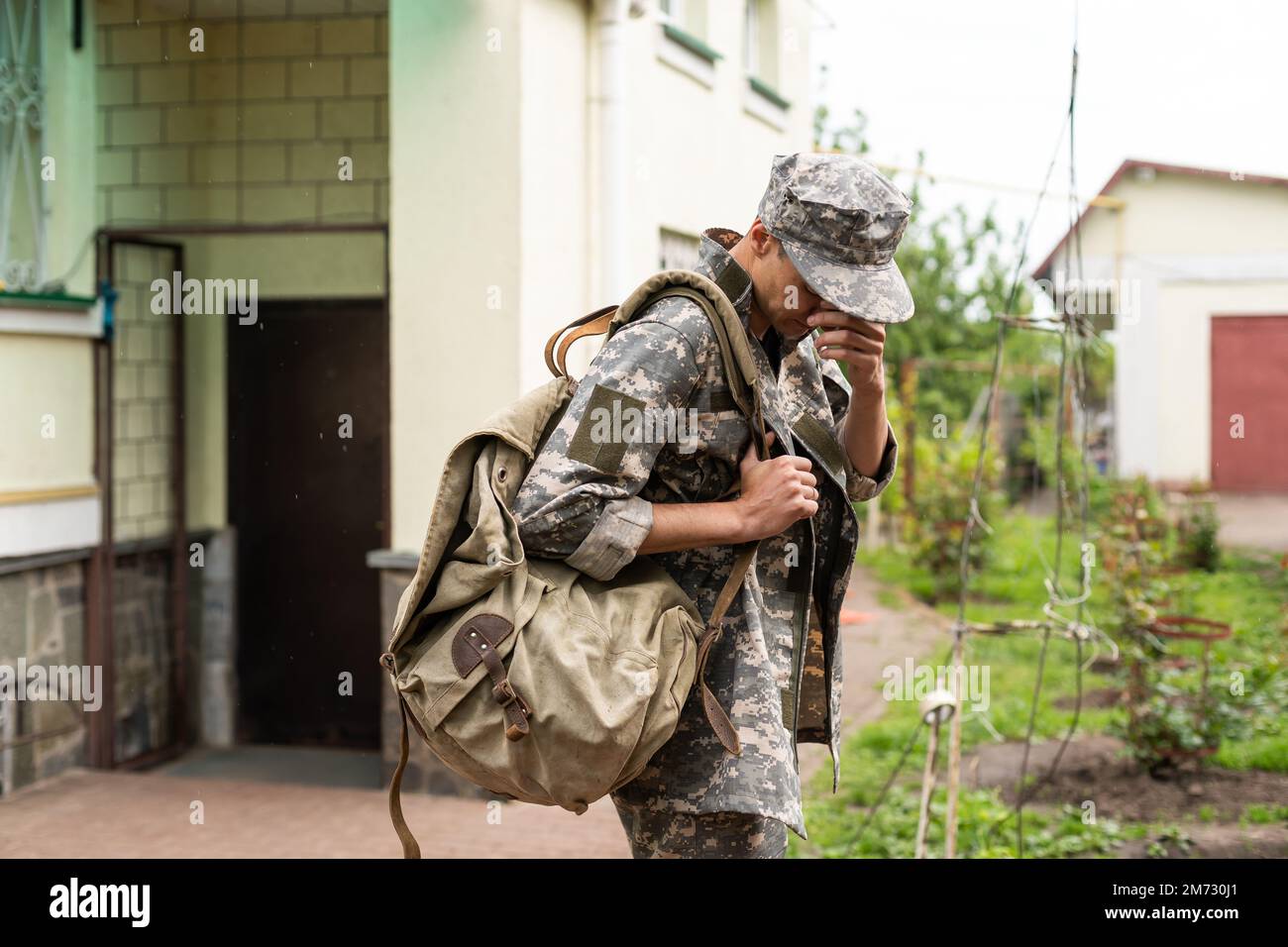 Portrait of calm serious Caucasian military man wearing camouflage ...